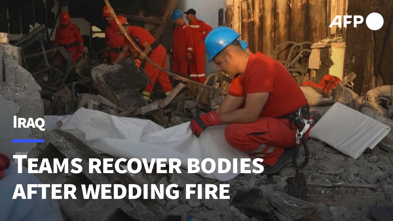 Rescue teams recover bodies after Iraq wedding fire tragedy | AFP - YouTube