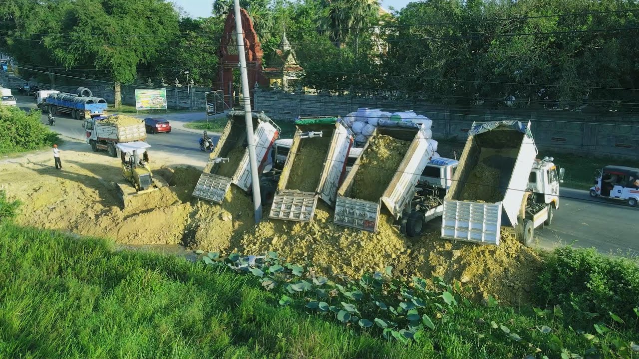 Nice Technique Landfill Around Deep Water Extremely Komatsu D31p Dozer Process with Mini Dump ...