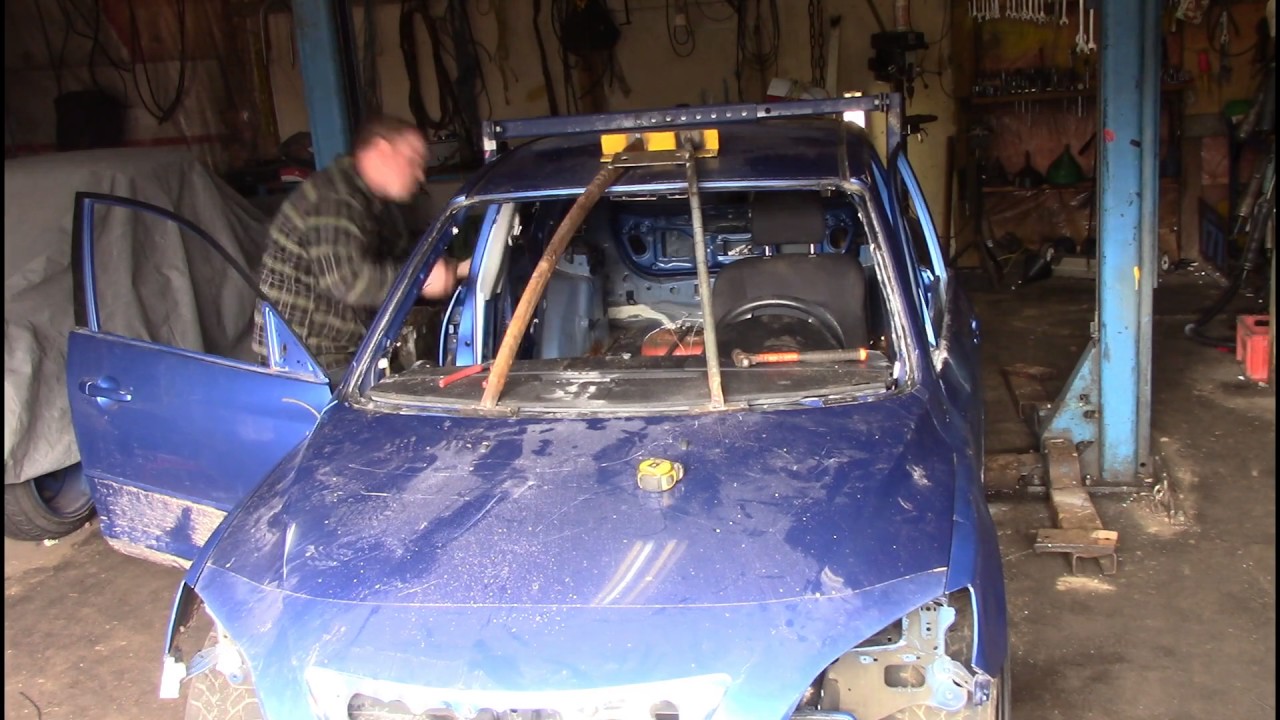 mazda 3 hatch bolt in cage install for demolition derby - YouTube