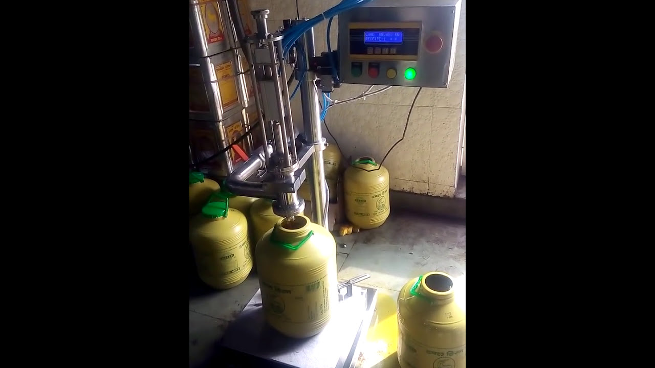 Load cell base filling machine - YouTube