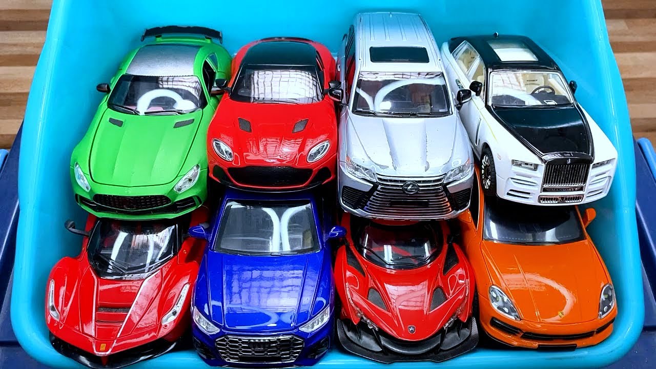 Box full of various miniature cars Jaguar, Peugeot, Renault, Hyundai ...