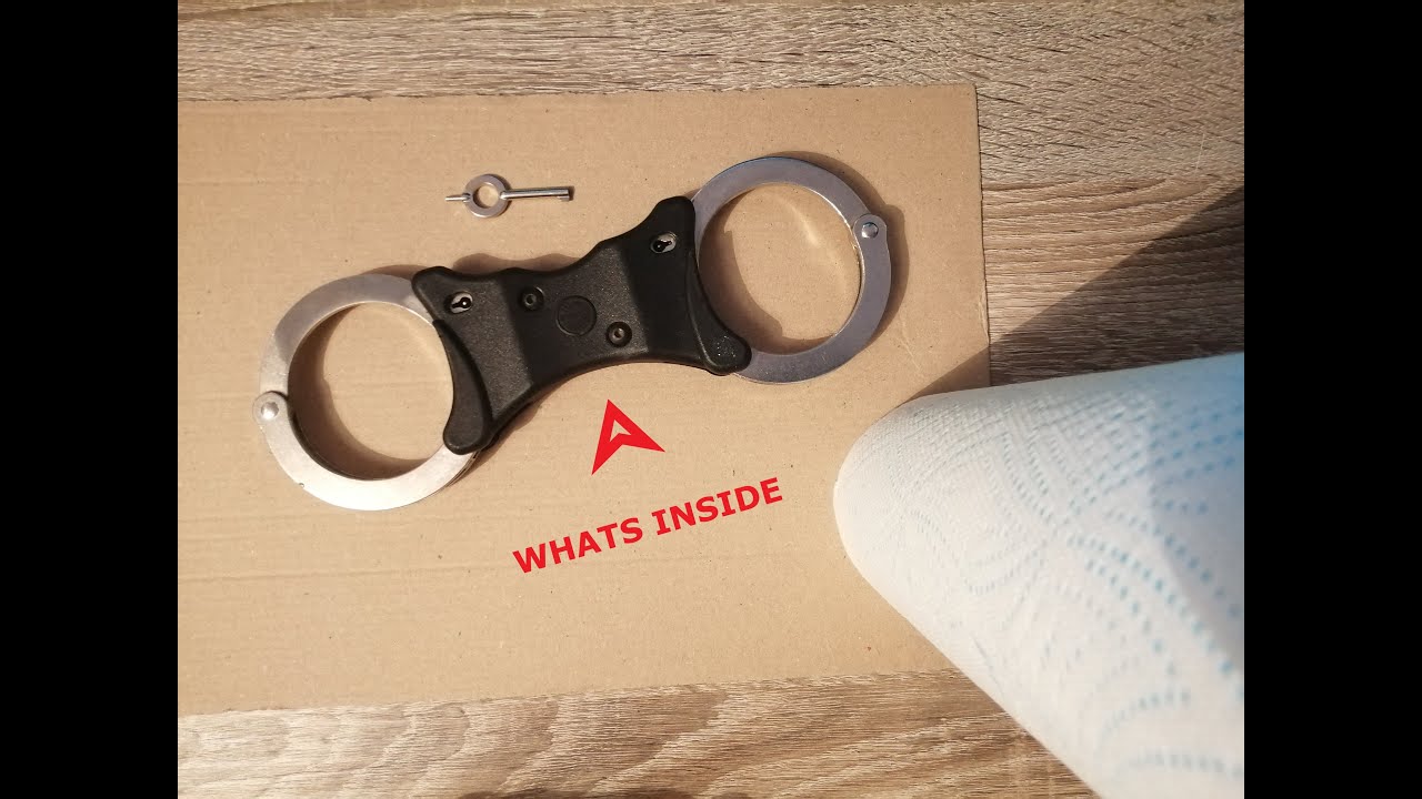 HIATTS HANDCUFFS - WHATS INSIDE THAT HANDLE - YouTube