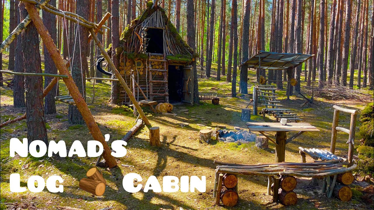Building of a log cabin and a camp in the forest. Life of a nomad ...