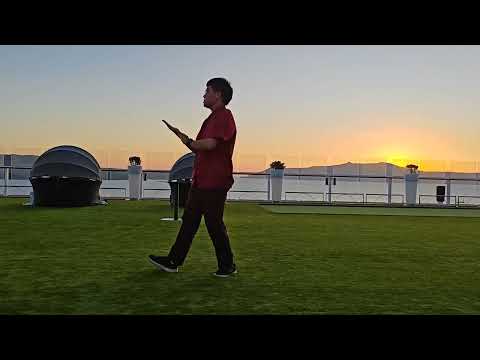 Woodford asd boy practicing Taichi at sunset by the Aegean Sea