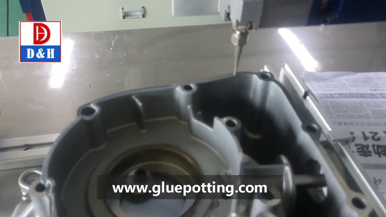 glue potting machine for engine case - YouTube