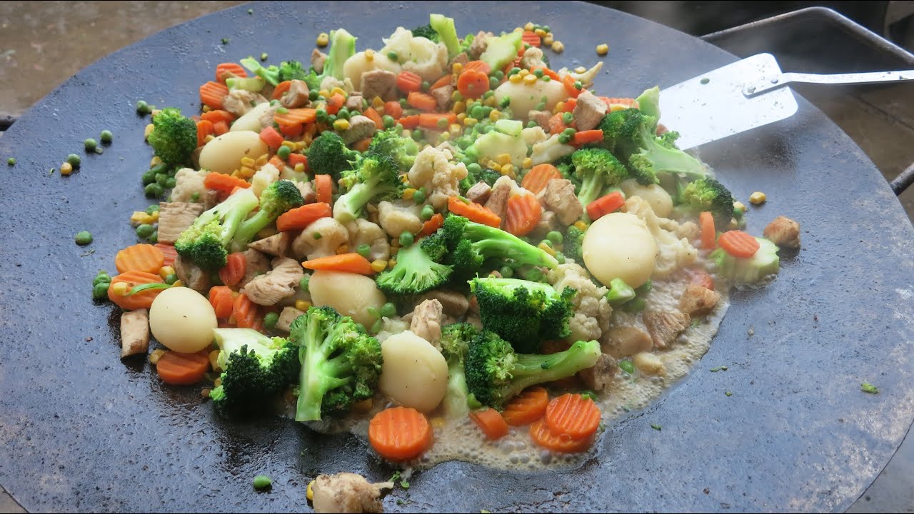 cooking food in the rain. Great meal. - YouTube