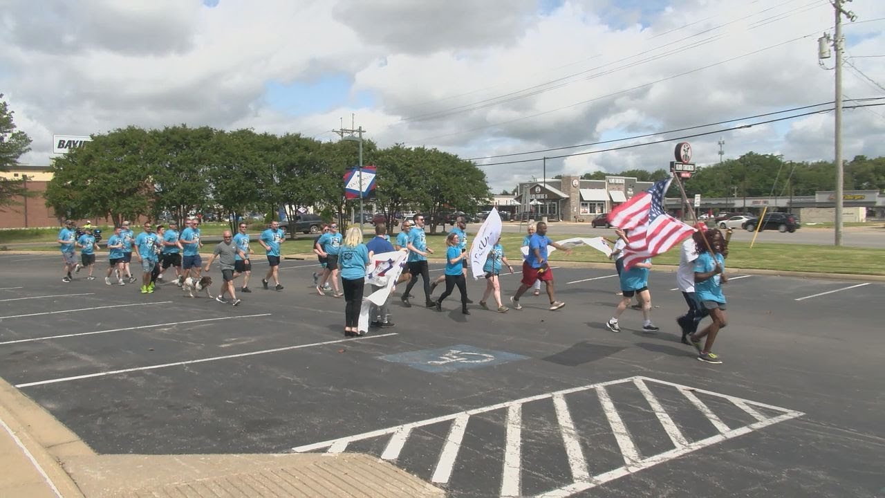 Law Enforcement participate in torch run - YouTube