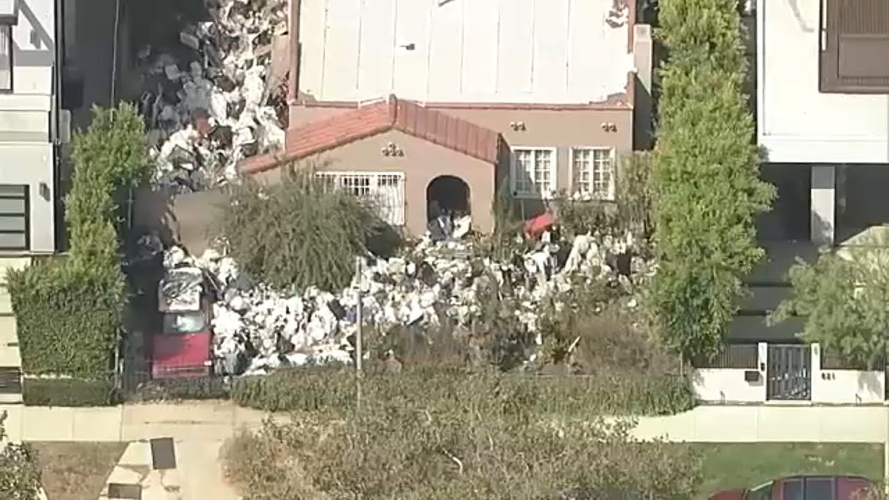 SoCal home covered in trash again 1 year after debris was removed - YouTube