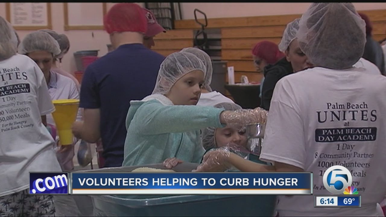 Volunteers helping to curb hunger - YouTube