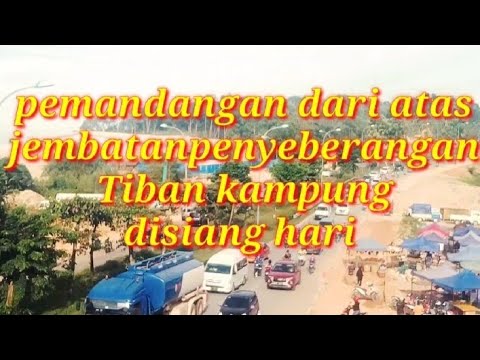 pemandangan siang hari dari atas jembatan penyebrangan tiban kampung ...