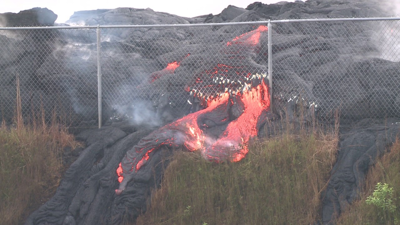 Puna lava flow 2014 11 14 Lava flows through fence - YouTube
