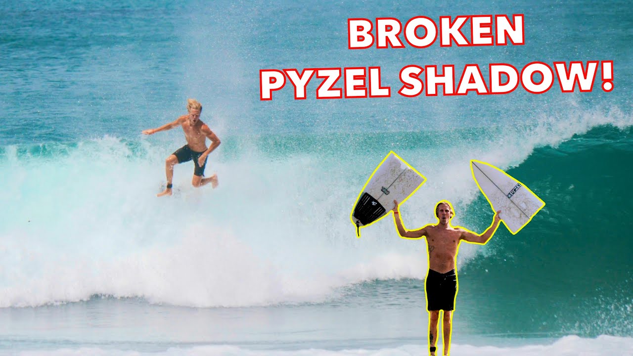 Broken Surfboard By Beach