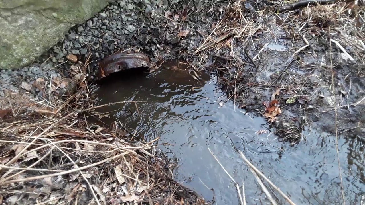 Clearing a drainage Culvert - YouTube