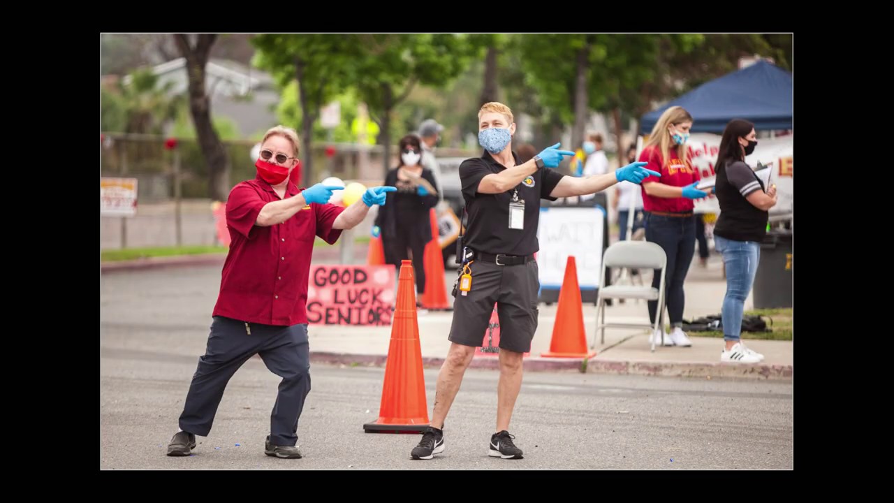 El Modena High staff distribute yard signs to their graduating seniors ...