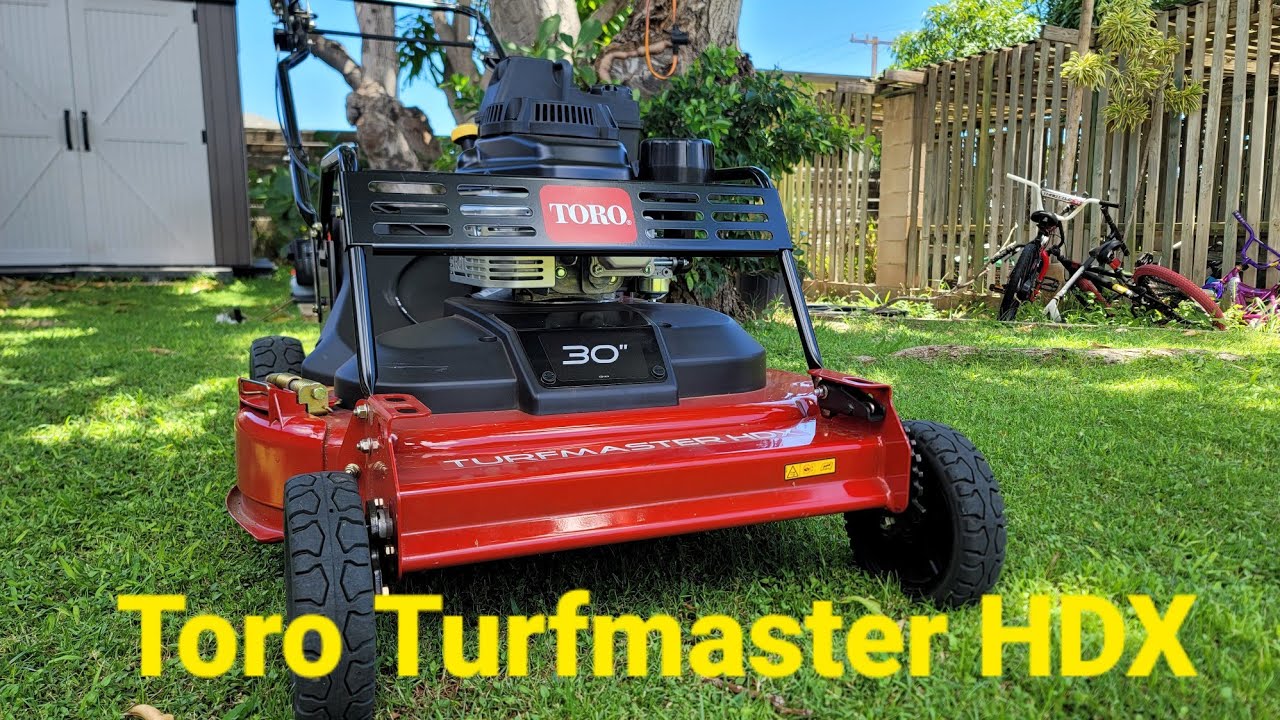 Toro Turfmaster HDX cutting thick wet overgrown grass. Stihl KMA-131R ...