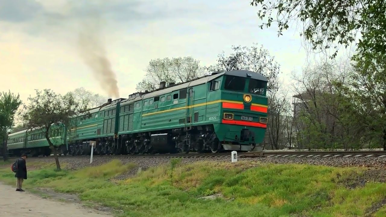 Diesel locomotive 2TE10V-5051with commuter train No. 6050 - 6051 ...
