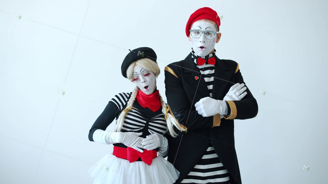 Man and woman funny mimes eating invisible food then fighting throwing ...