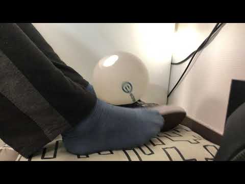 Stomping on the balloon in my vans slip ons and blue socks