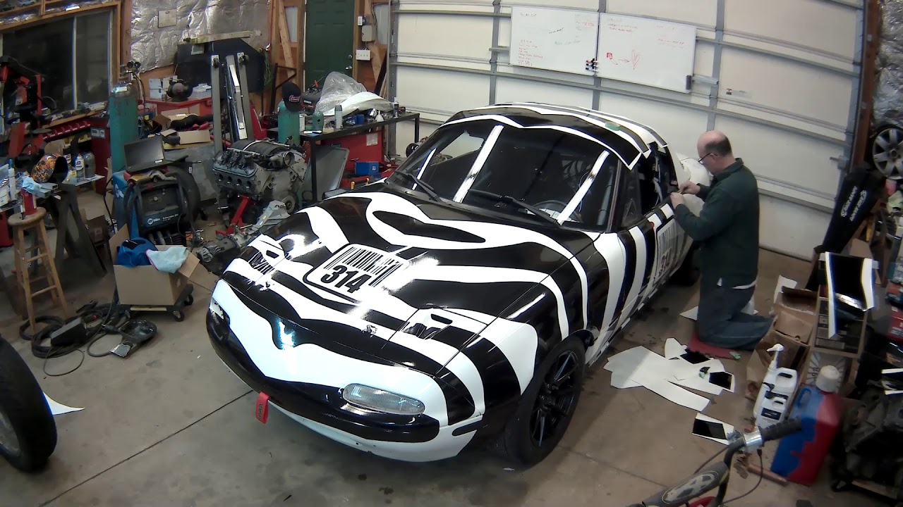 Applying vinyl graphics on Miata - zebra themed race car - YouTube
