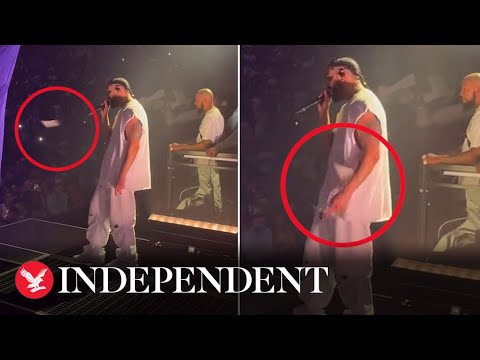 Drake hit with phone on stage during opening night of tour - YouTube