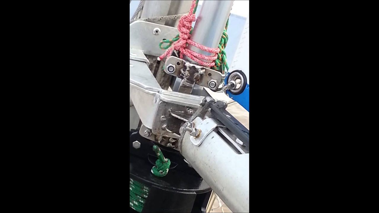 Mainsail furling placed behind the mast and UNDER THE BOOM - YouTube