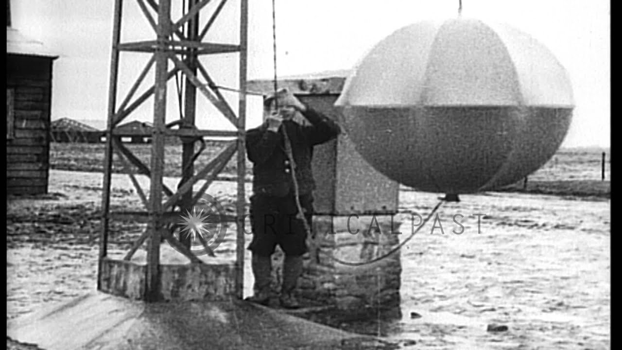 French signalman raises signal ball on a semaphore tower in France ...