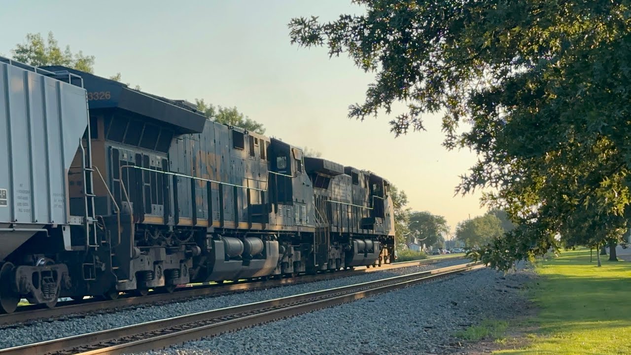 NS 9718 C44-9W leads NS 65K through Manville NJ CSX ET44AH trailing and ...