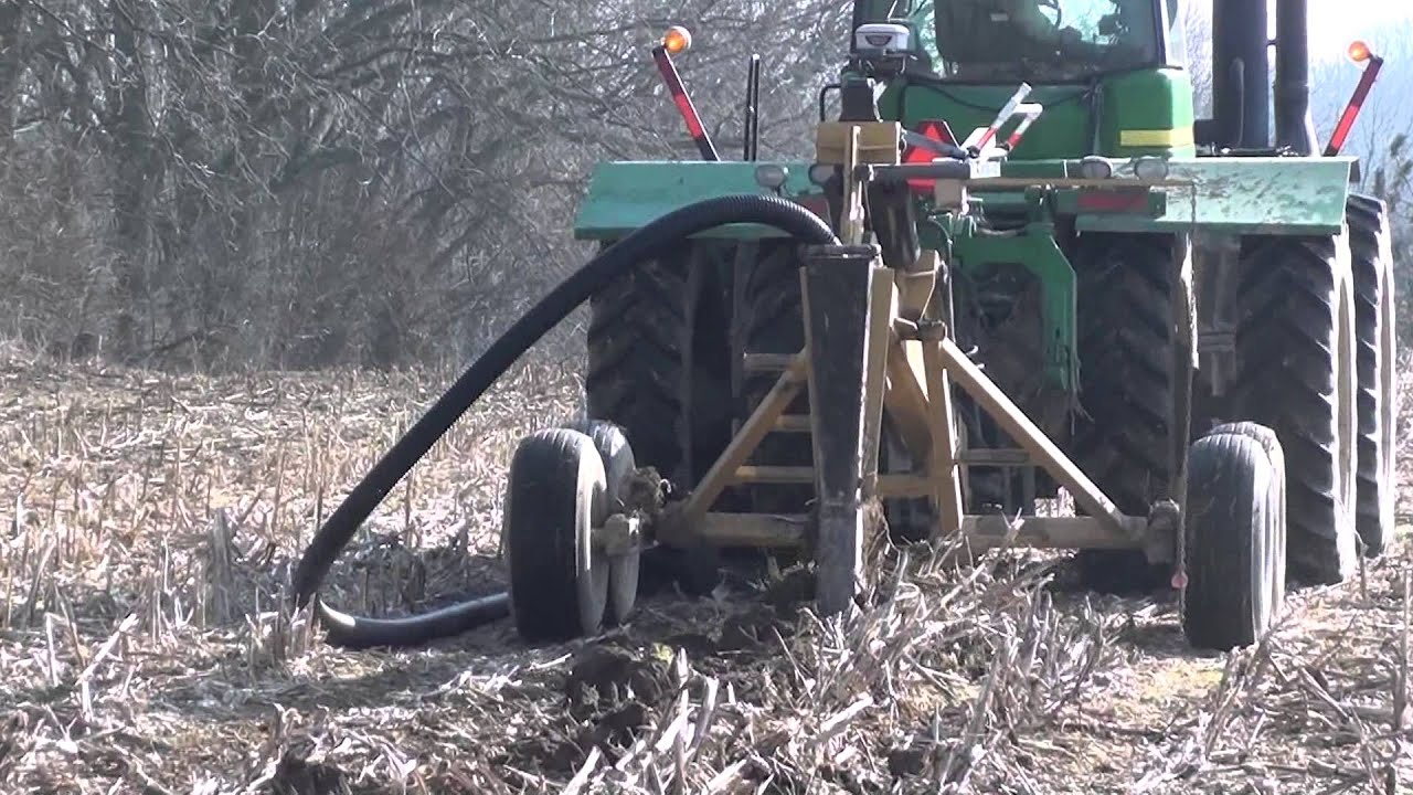 Laying tile in field - YouTube
