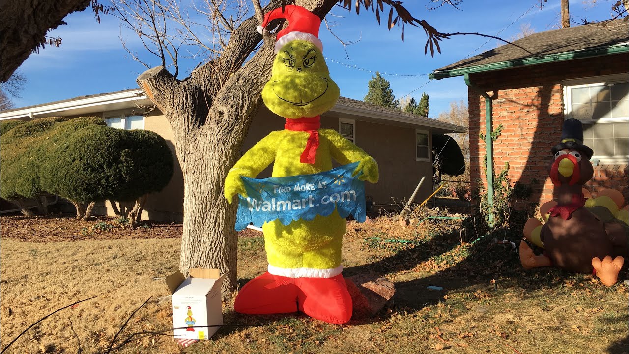 Gemmy airblown inflatable fuzzy plush grinch holding Walmart banner ...