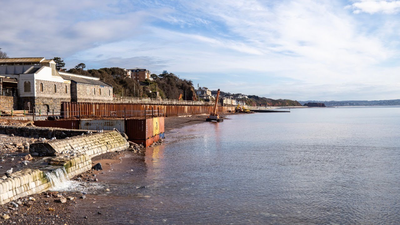 Installation of the new sea wall panels - YouTube