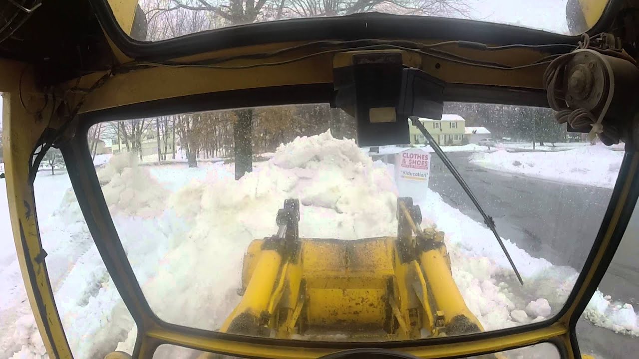 Moving snow with the front loader - YouTube