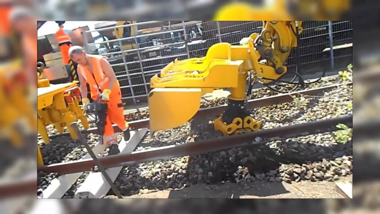 Sleeper changer and ballast tamper in action - YouTube