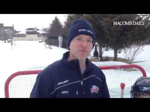 Keith Leduc talks about his backyard skating rink while his sons and ...