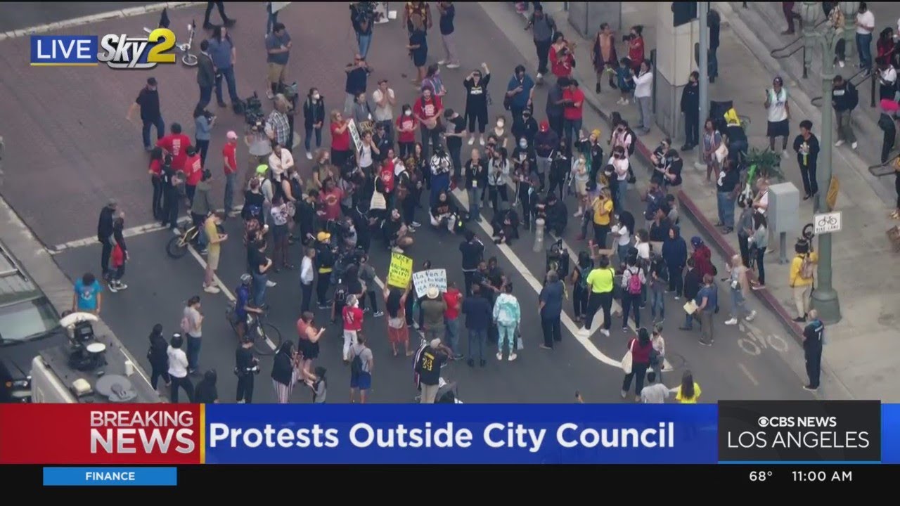 Protestors converge outside of City Council meeting - YouTube