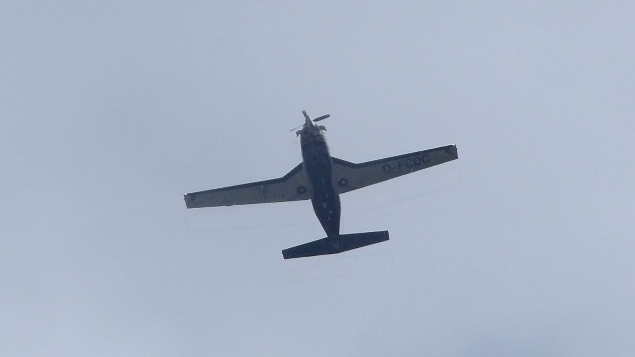 Small Propeller Plane Flying Right Over Airport Building During ...