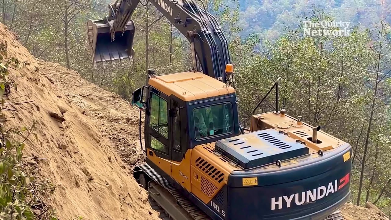 Excavator Slopes Down a Vertical Hill for a Wider Road | Amazing Road ...