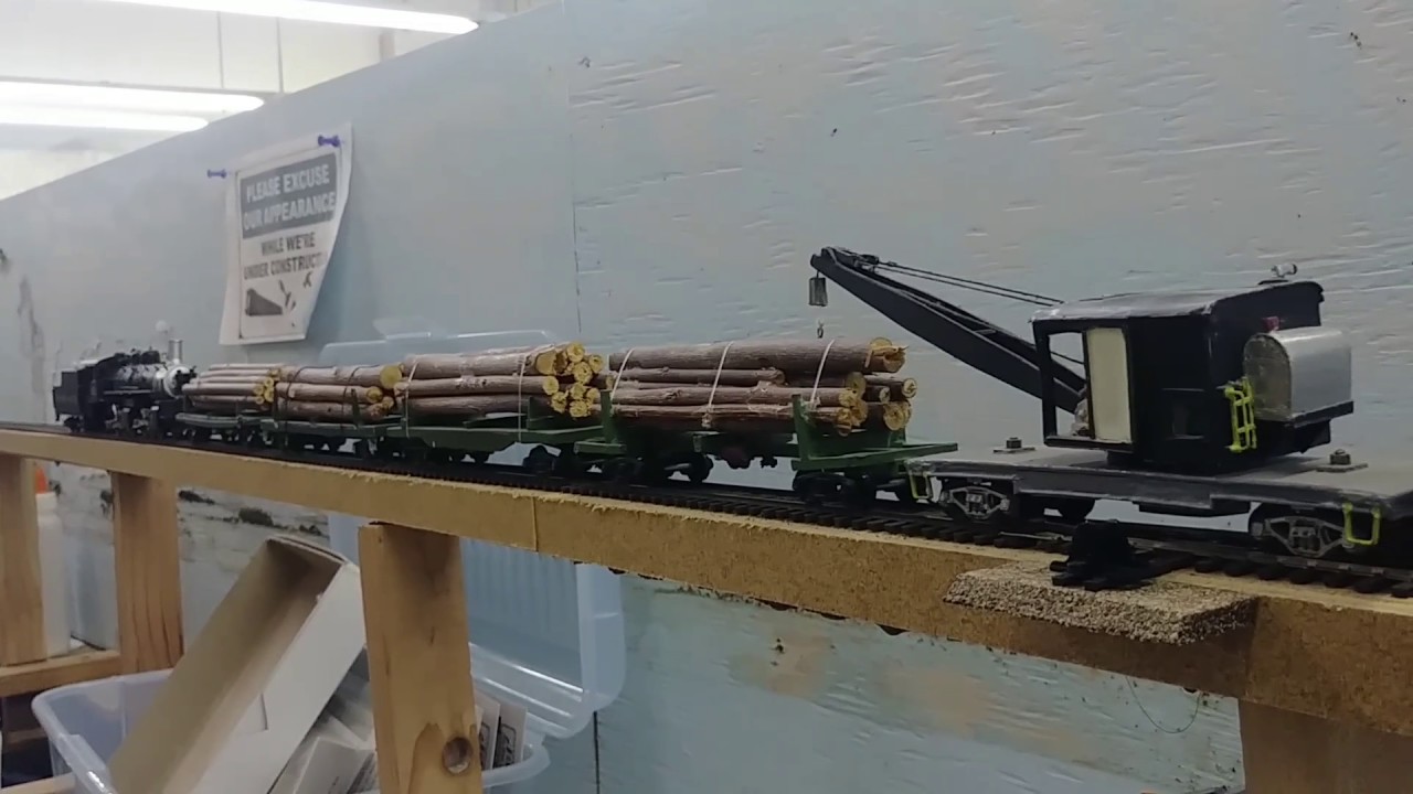 Log train climbs the grade to end of the line. - YouTube