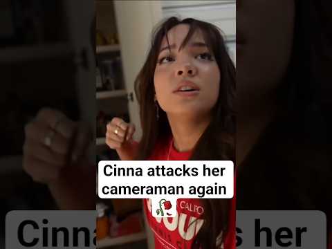 Cinna attacks her cameraman again