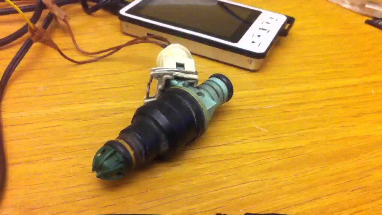 Fuel injector flow bench plays "the lion sleeps tonight" - YouTube