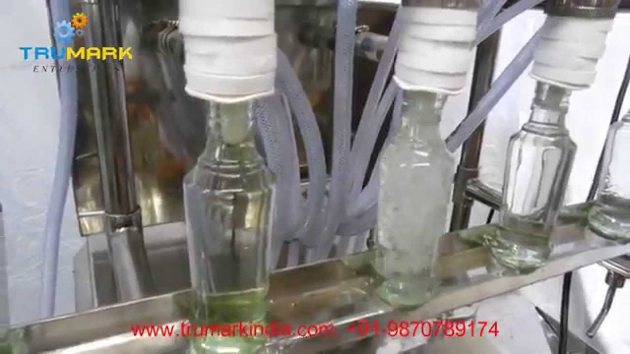 Liquor bottle filling machine, whisky filling machine, wine filler ...