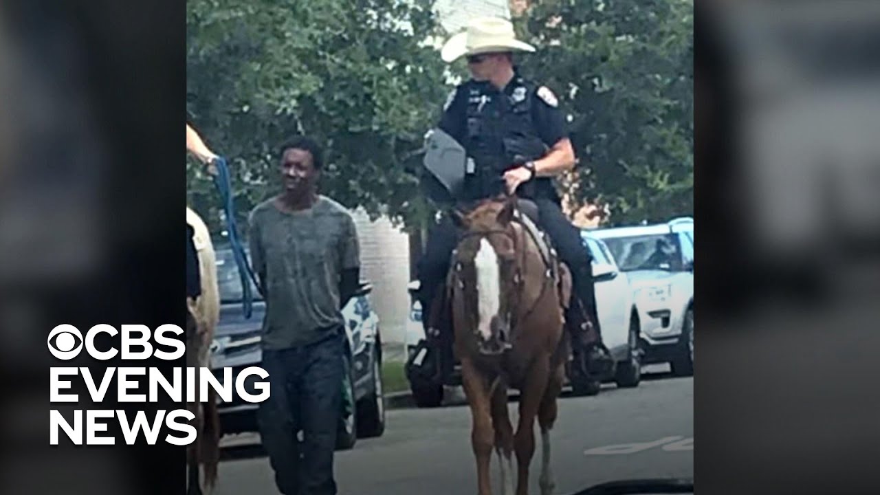 Picture of officers leading black man by rope sparks outrage - YouTube