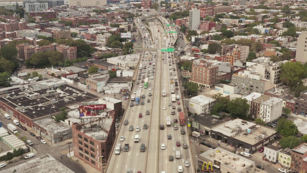 AERIAL: Over New York City Highway with busy car traffic on Grey day ...