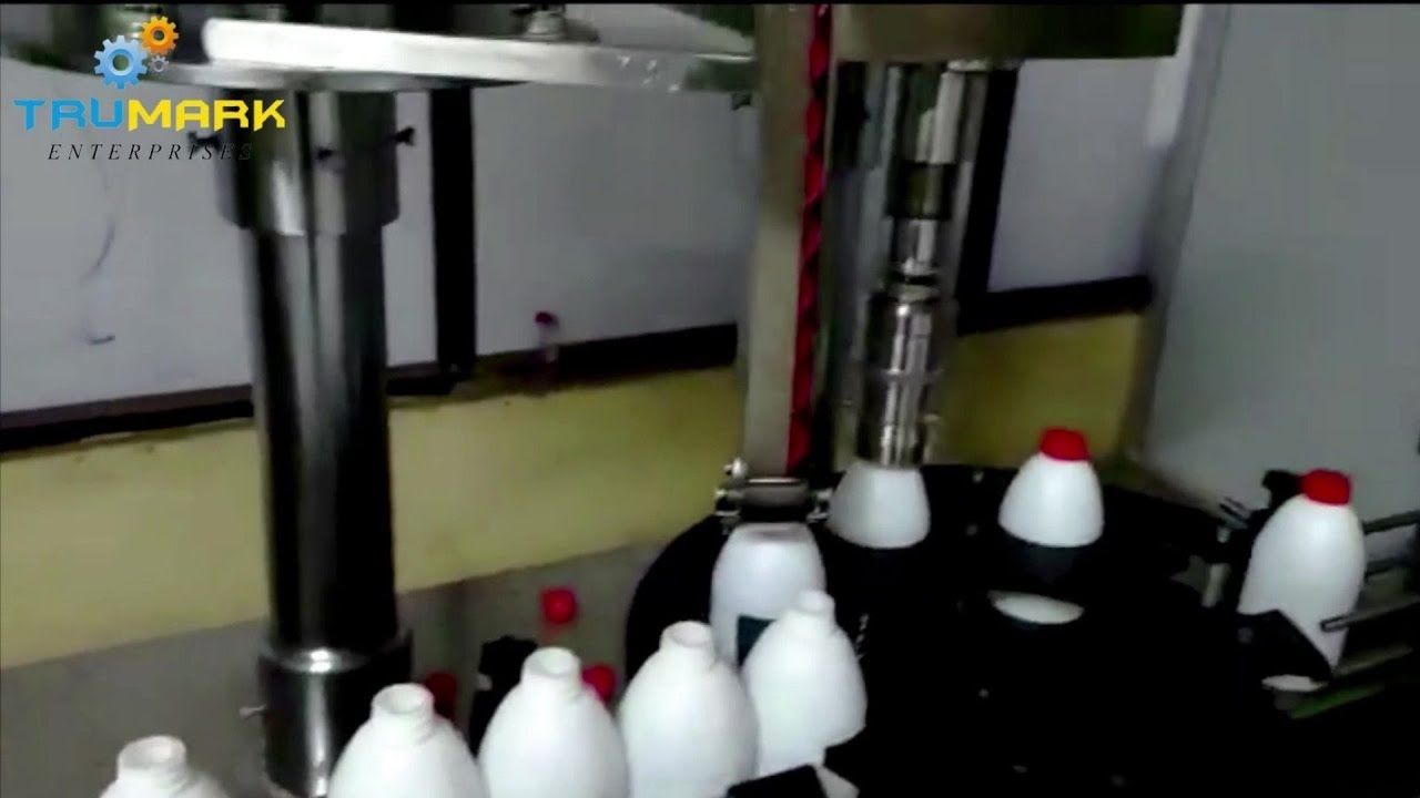 Automatic Gravity Liquid Filling, Inner Plug Pressing & Capping Machine - YouTube