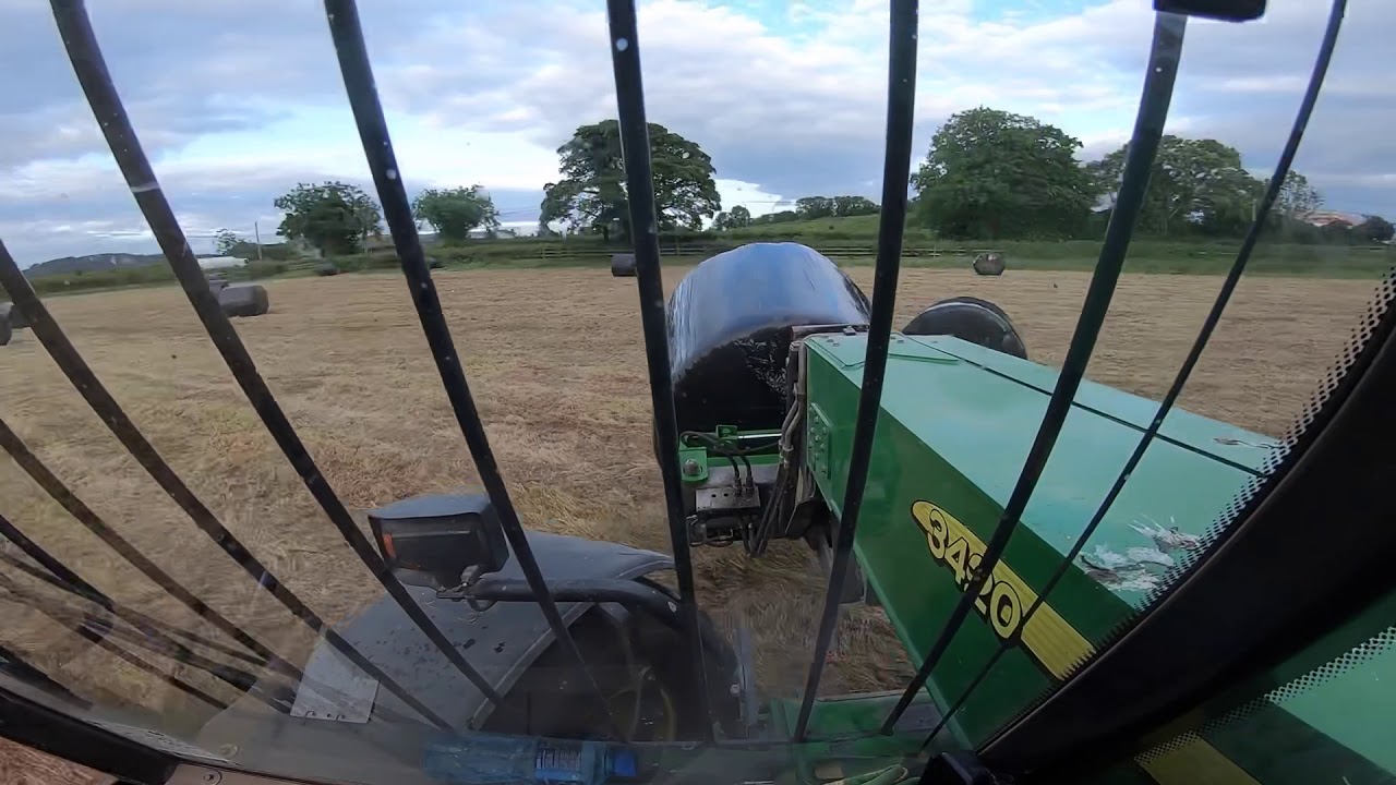 STACKING ROUND BALES - YouTube