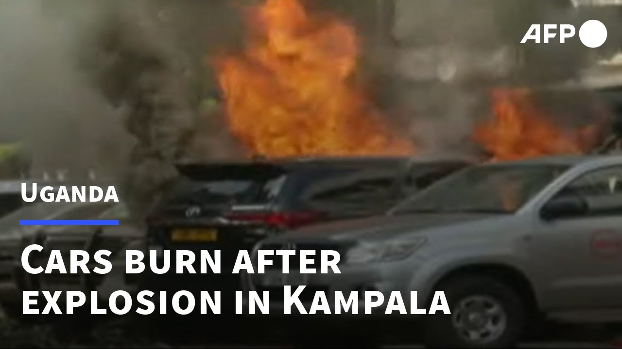 Car burns near Uganda parliament after explosion in Kampala | AFP - YouTube
