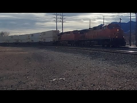 BNSF 5289 leads the Q-ALTPTL6-26A through springs on a cloudy day with an amazing horn show ...