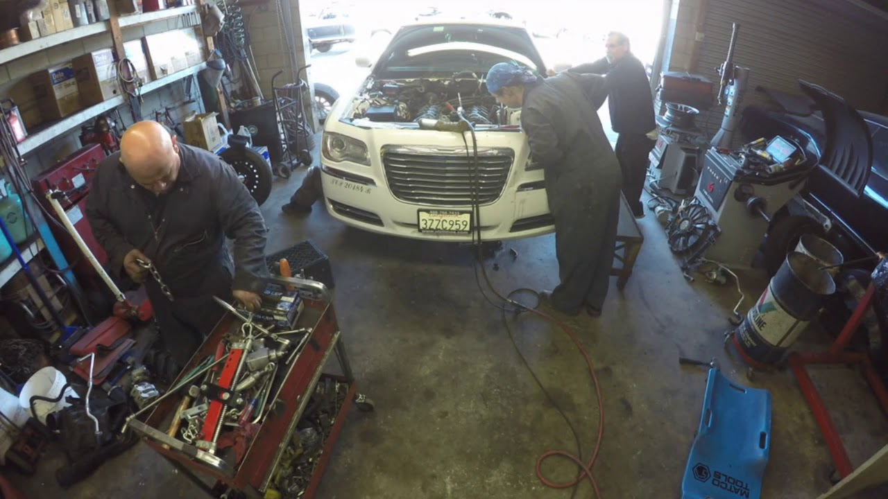 Chrysler 300 limo engine swap time lapse - YouTube