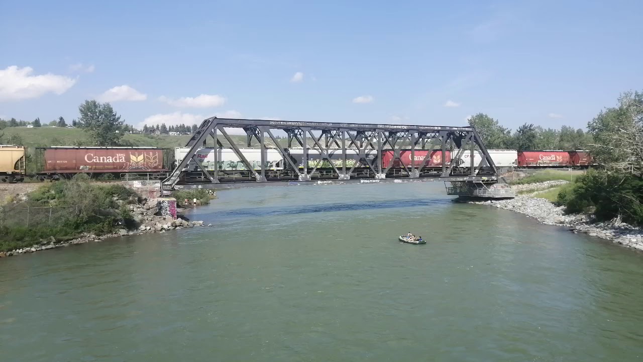 Large cargo train crossing Bow River in Calgary, Alberta, Canada - YouTube
