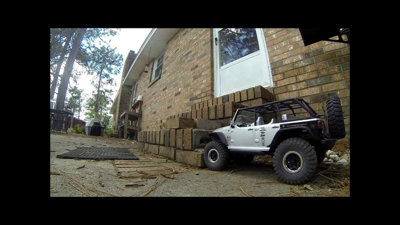 Axial scx10 jk rubicon battery relocation results - YouTube