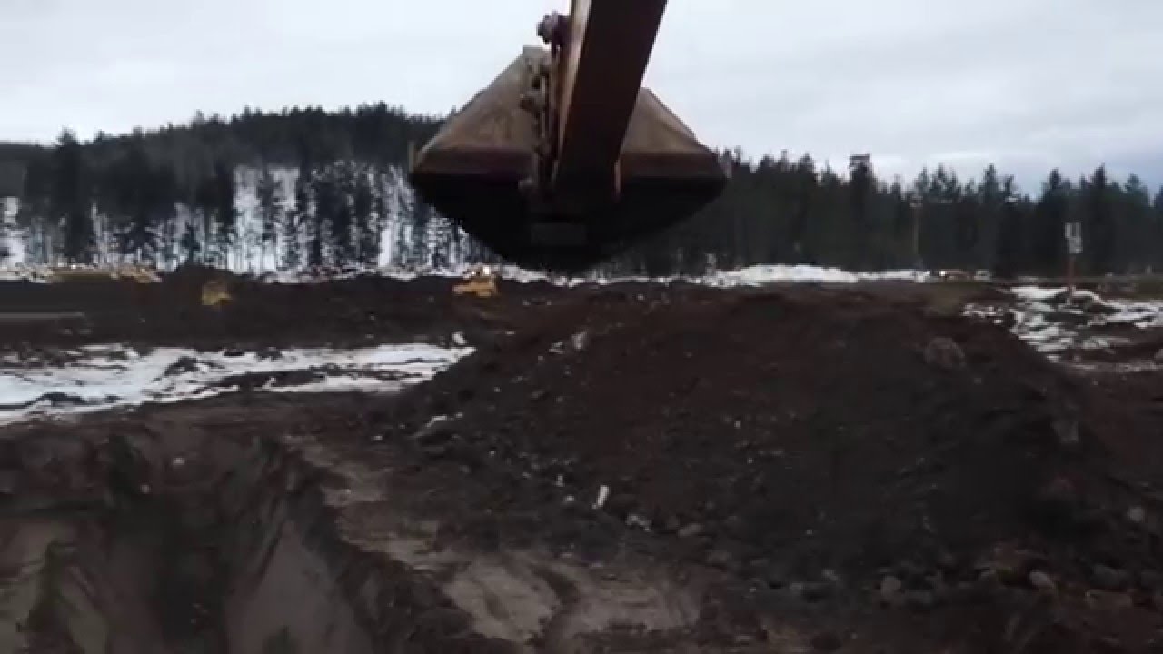 excavating a V ditch - YouTube